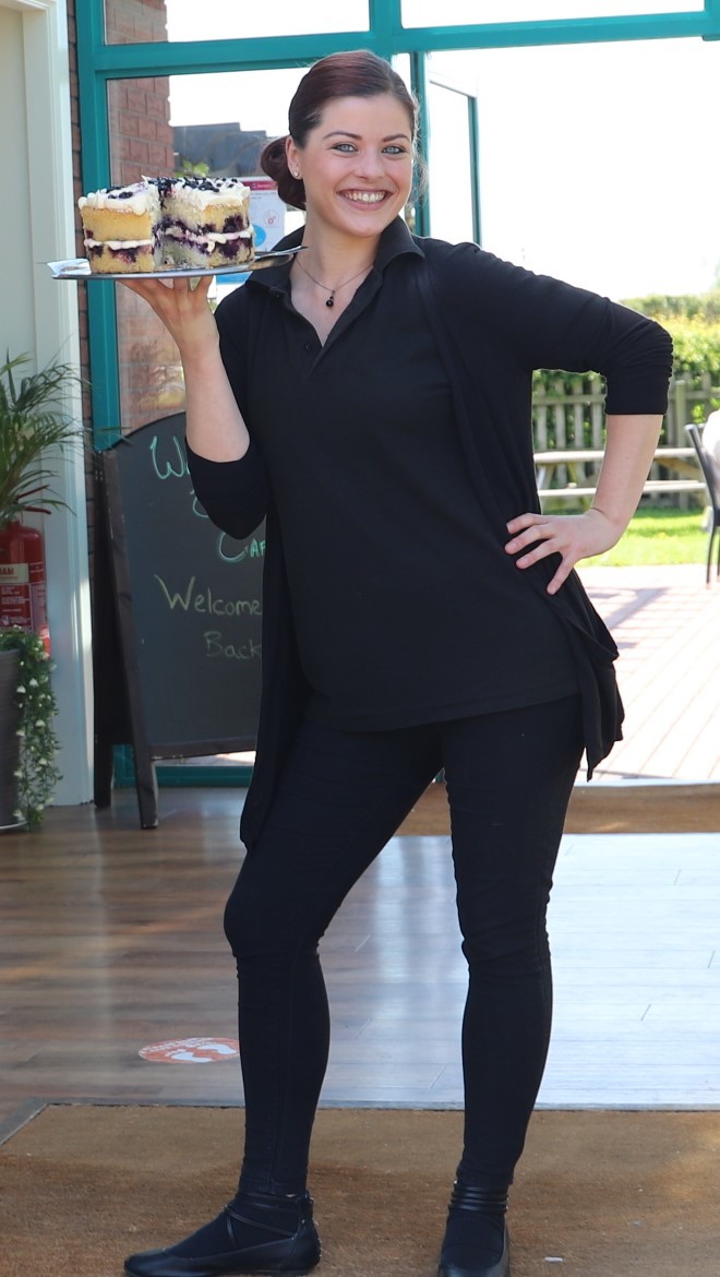 Abi welcomes visitors to Walled Garden Cafe - Derwen College